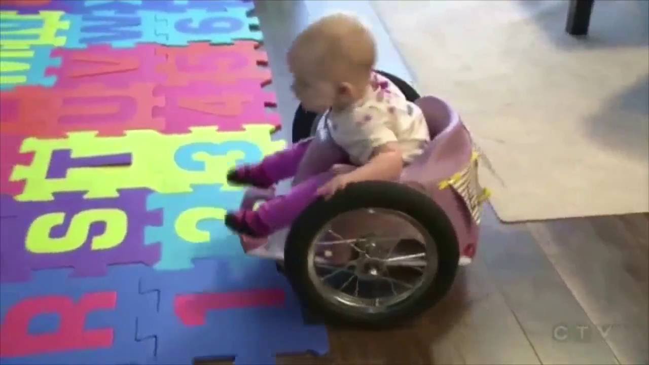 Toddler with paralysis around in homemade wheelchair - Evelyn Moore ...