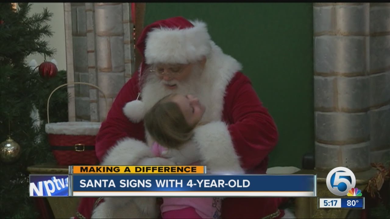 Santa signs with 4-year-old - YouTube