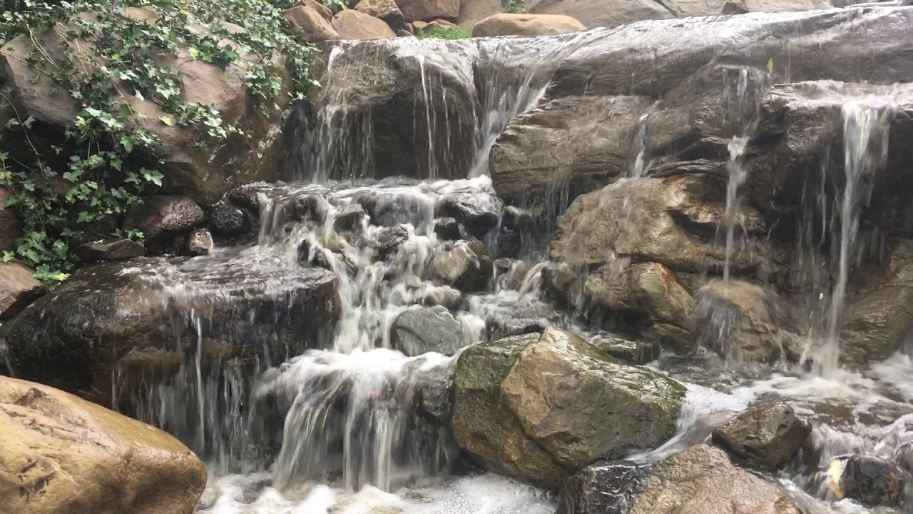 Wide waterfall with multilevel spillways - YouTube