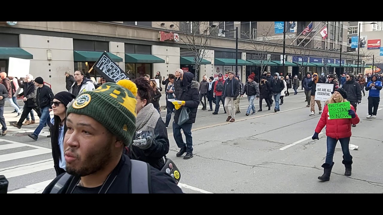 Toronto police and lockdown protest march on Yonge Street January 16 ...