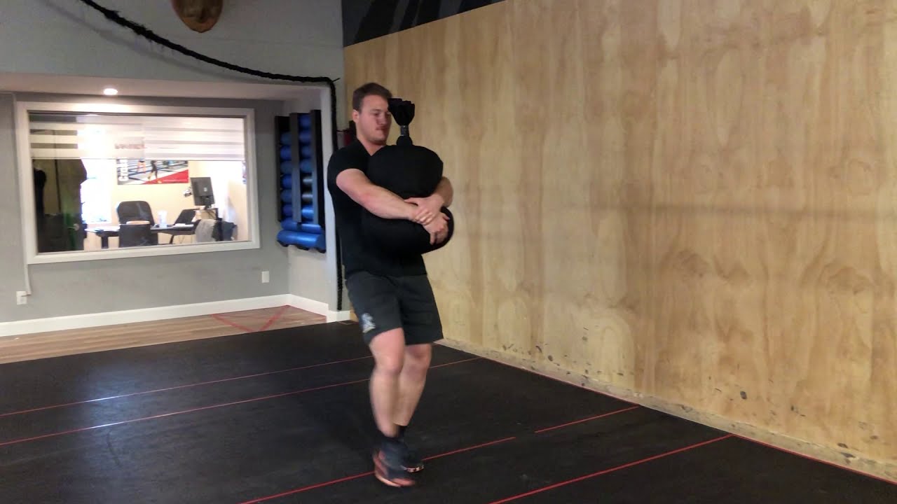 Sandbag bear hug carry walk - YouTube