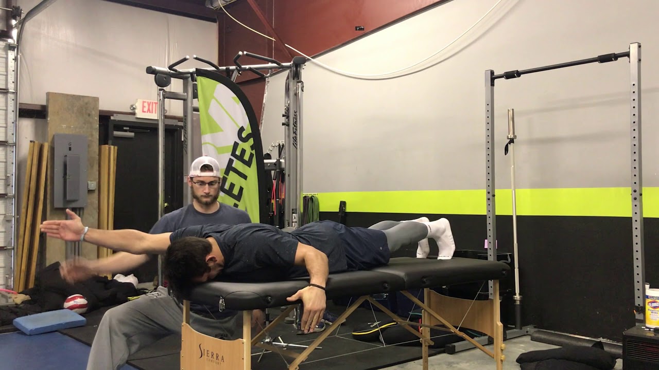 Prone 1-arm Trap Raise - YouTube