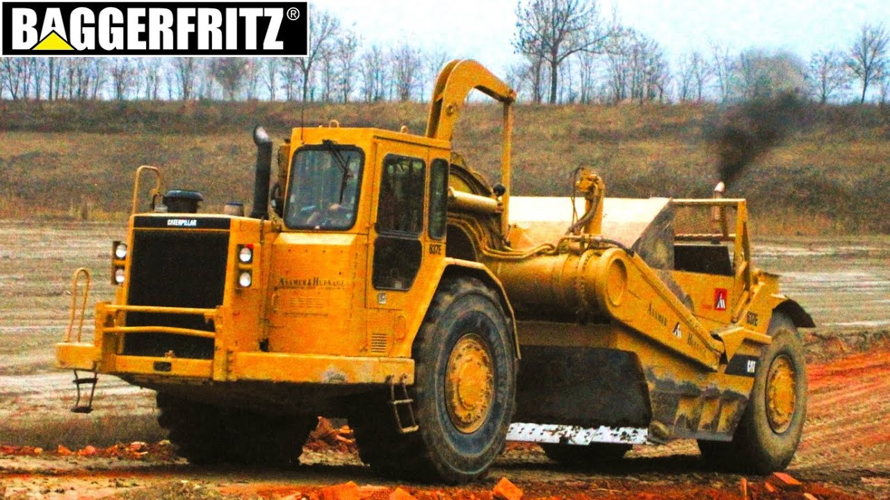 HUGE Caterpillar 637E and 637G motor scrapers are moving dirt - YouTube