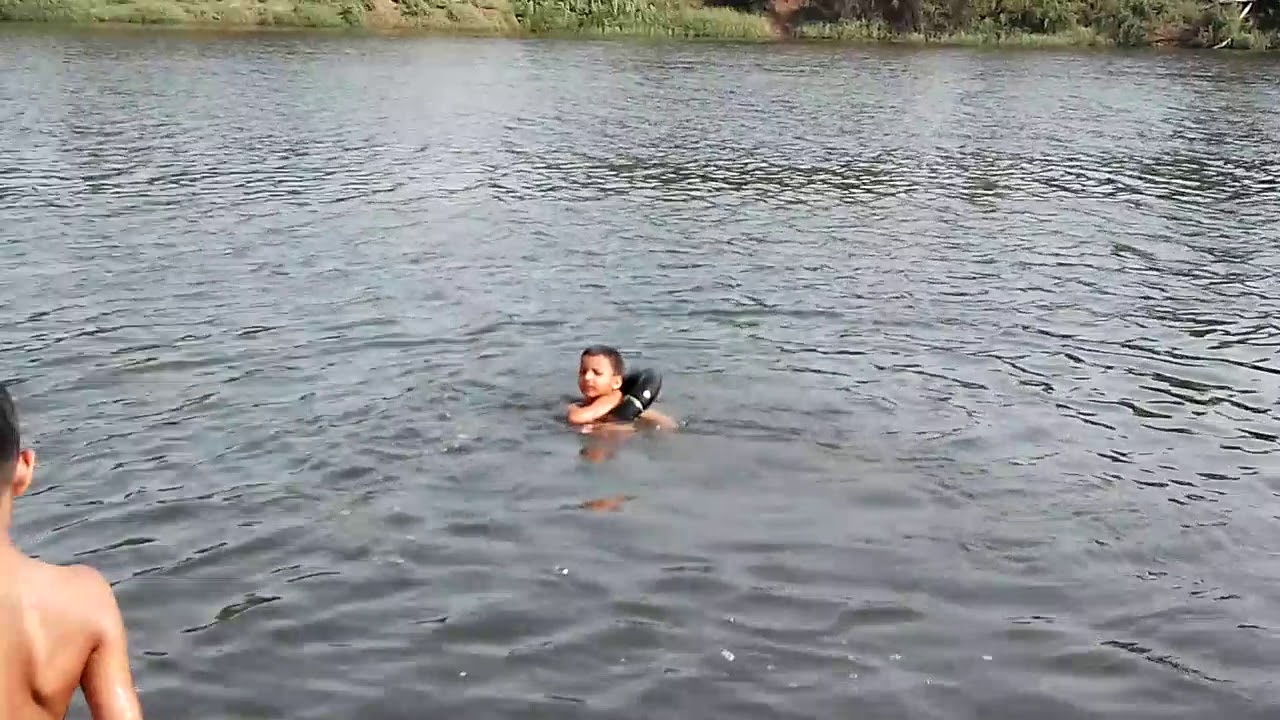 Child swimming in river(3) - YouTube