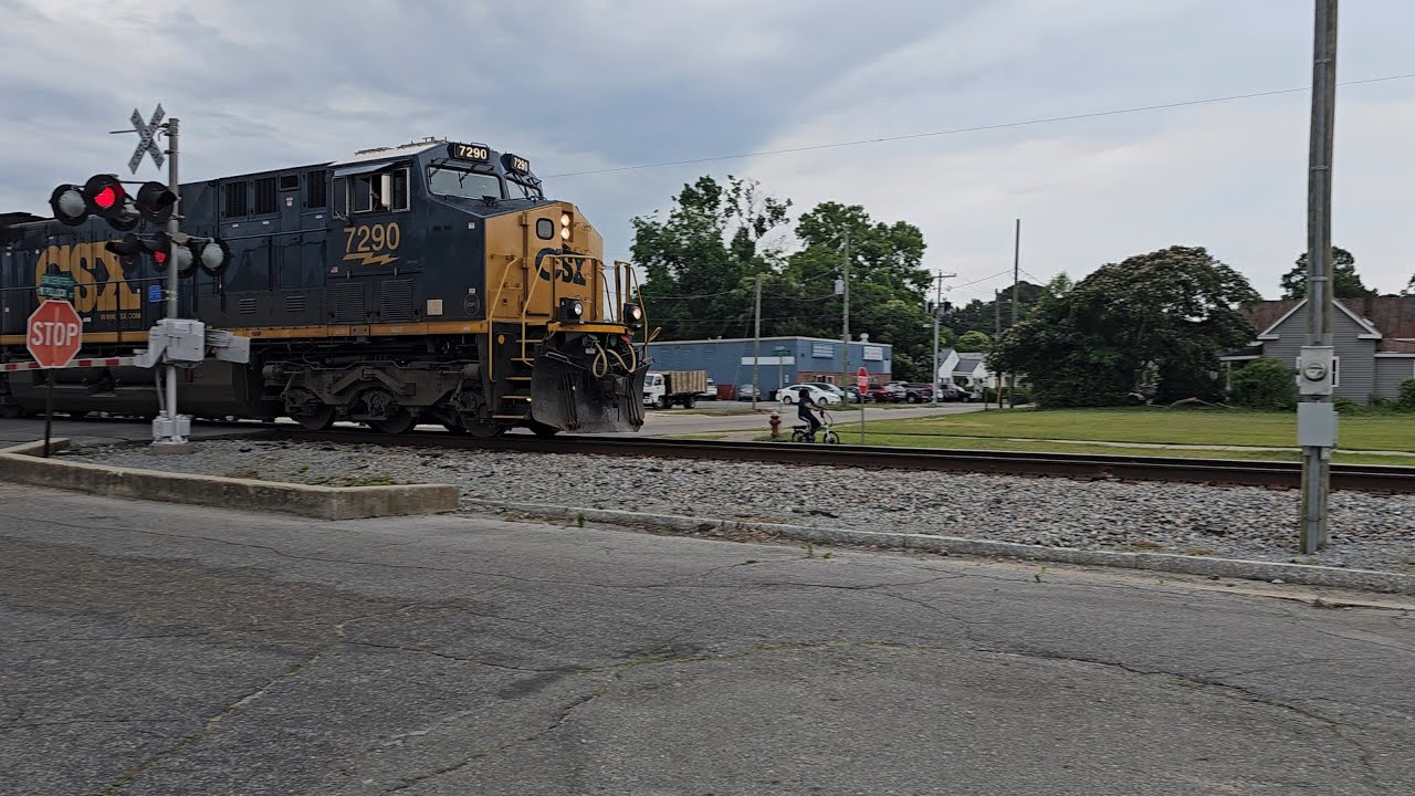 Loaded Soybean Train with a CSX CM44AC & ES40DC comes on into Town with Horn Salute heading ...