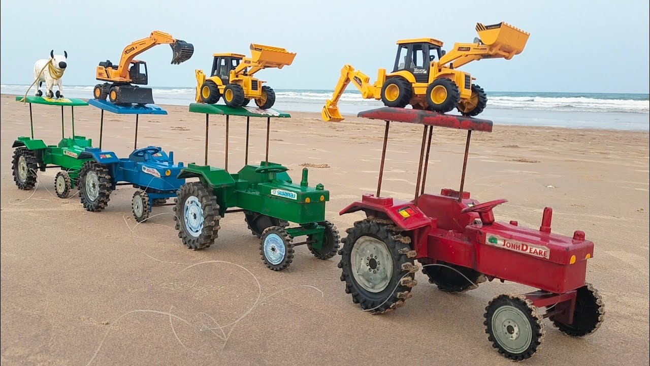 Mini Tractor loading jcb bull near beach - YouTube