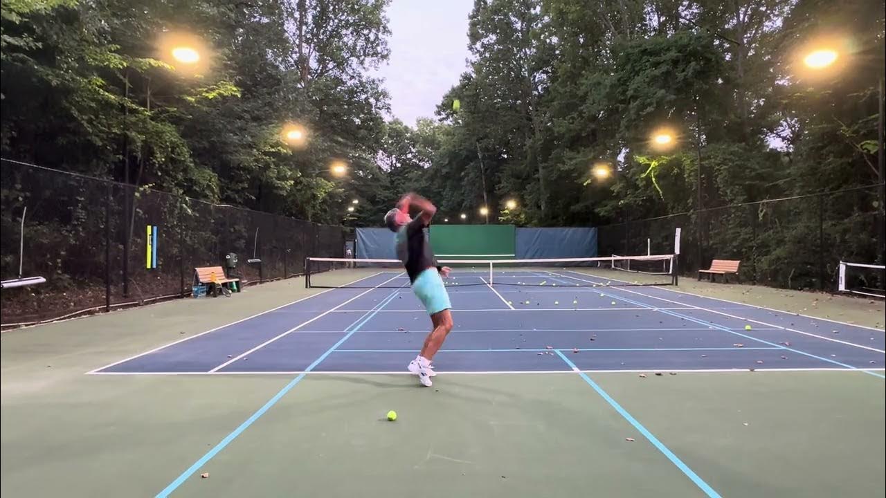 Dad demonstrating effortless serve power to 10 year old son. - YouTube