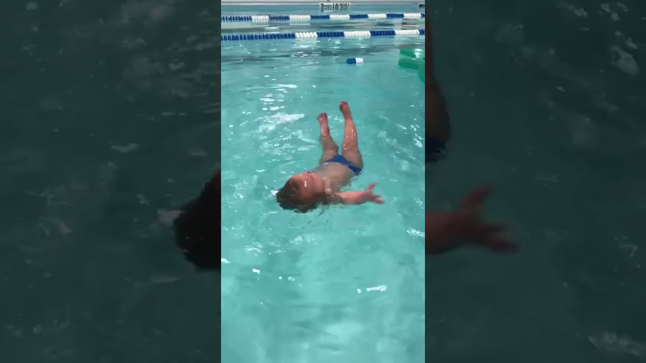 baby swim lessons thrown in pool #shorts 3 - YouTube