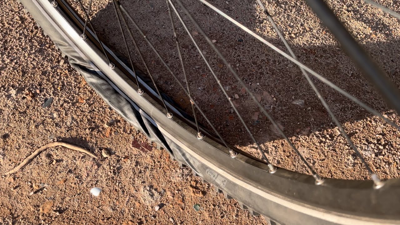 Soft/flat front tire at sunset - riding, flexing, deflating - YouTube