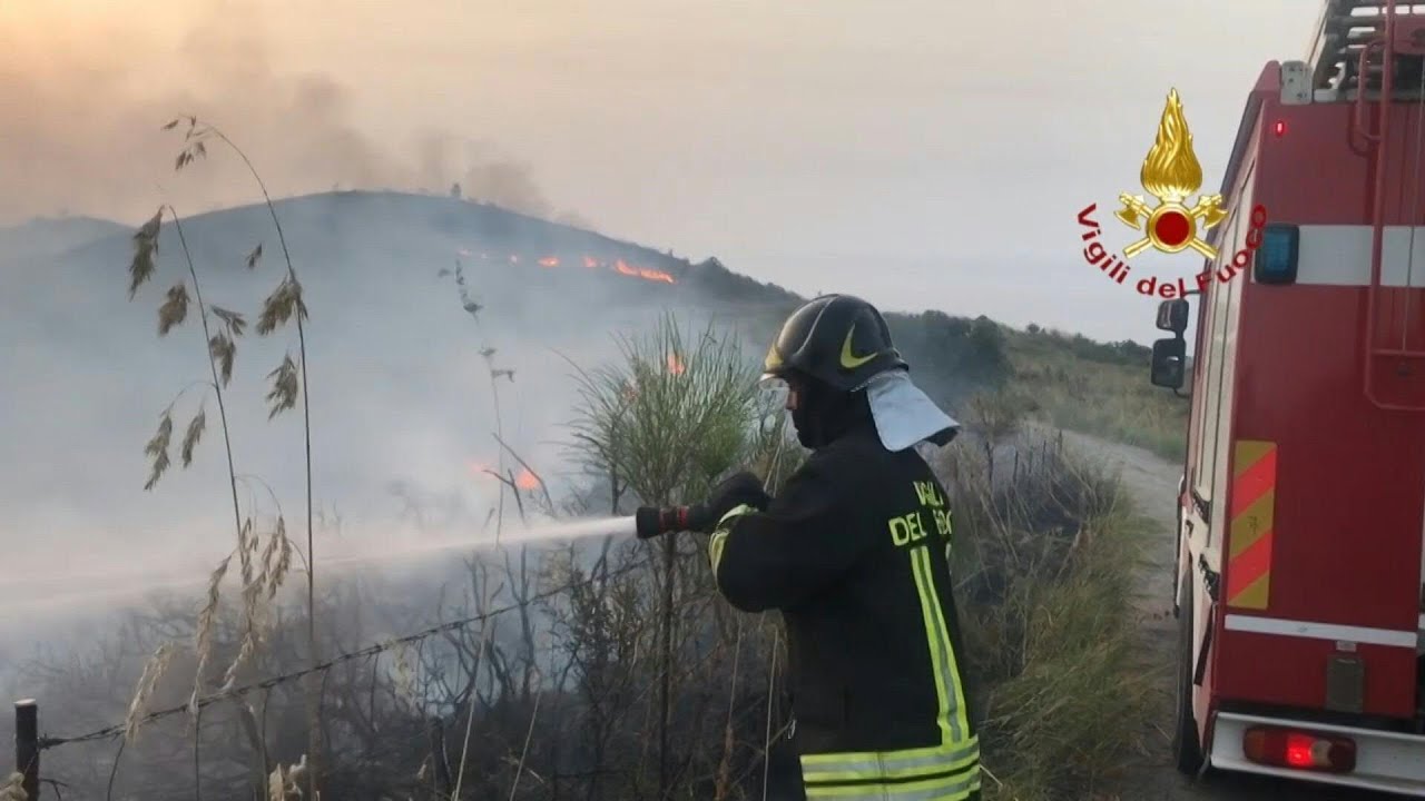 Italian firefighters battle coastal wildfires | AFP - YouTube