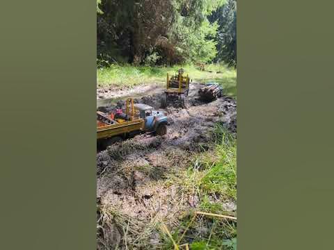 rc Kamaz log truck driving pass two king Kong zil 130 in the mud ...