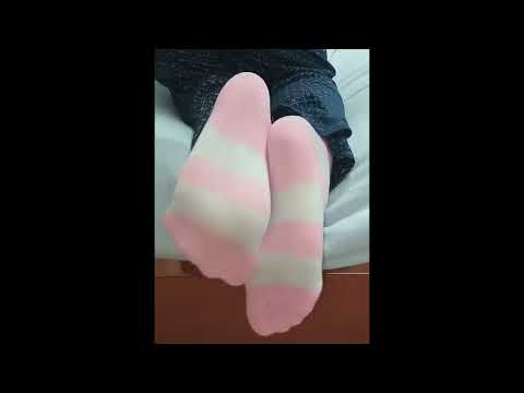 Femboy showing his feet in white and pink thigh highs :3