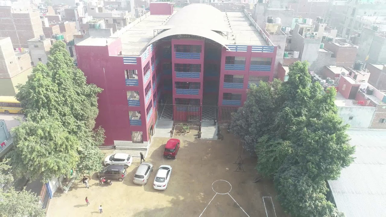Aerial View of School covering school campus,playground,boundary wall ...