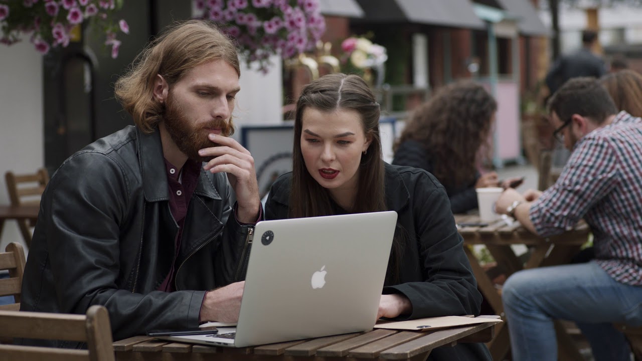 A Man and Woman Discussing Using Laptop - 4K B-Roll - YouTube