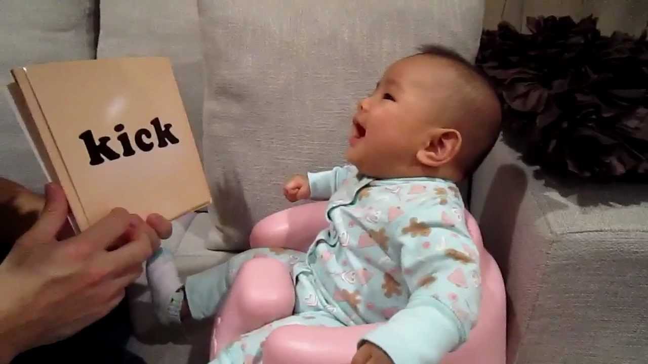 4 month old baby laughing while reading book - YouTube