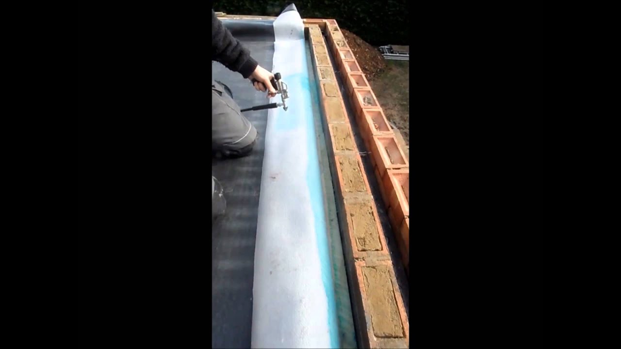 Spray adhesive on parapet wall with RubberBond EPDM roofing - YouTube