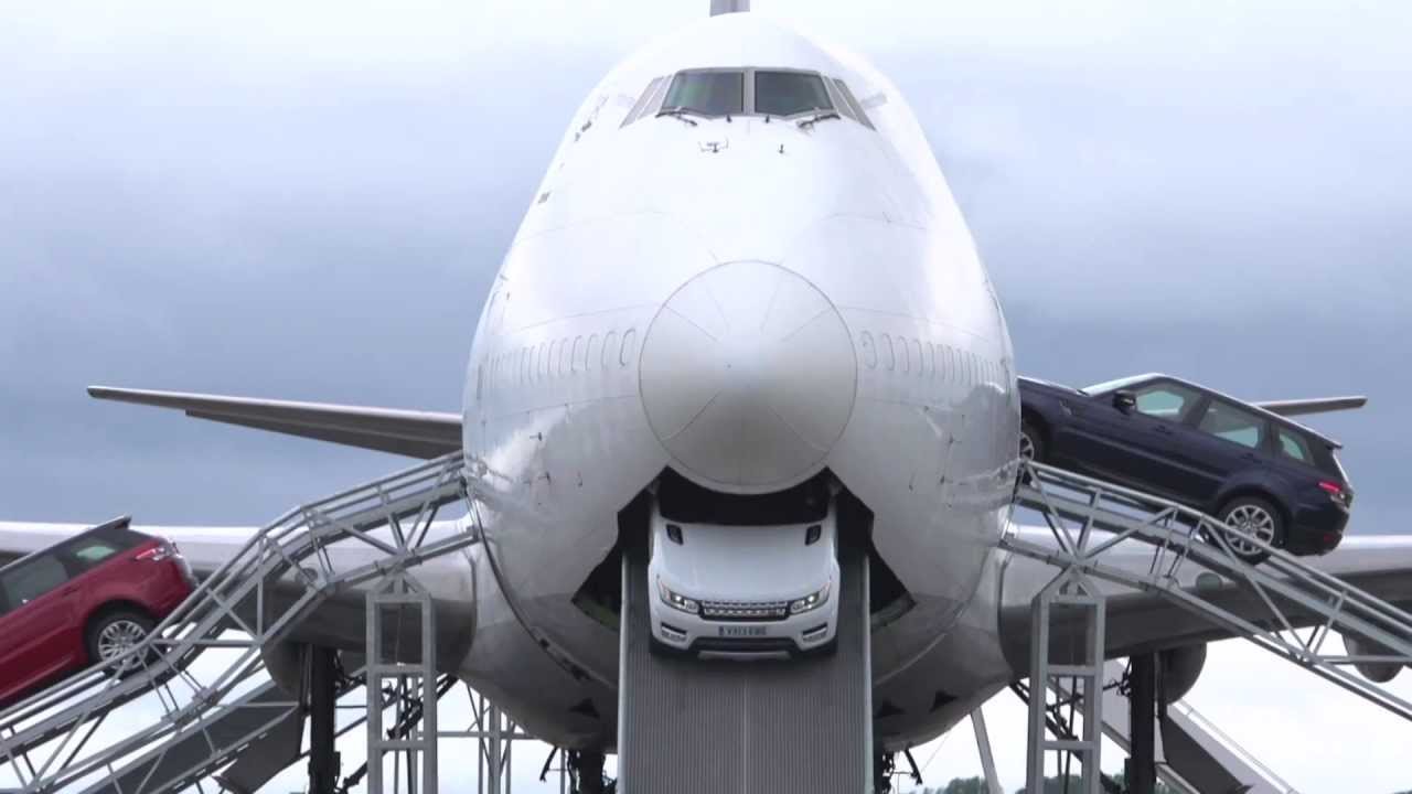 Range Rover Sport drives through a 747 plane - YouTube