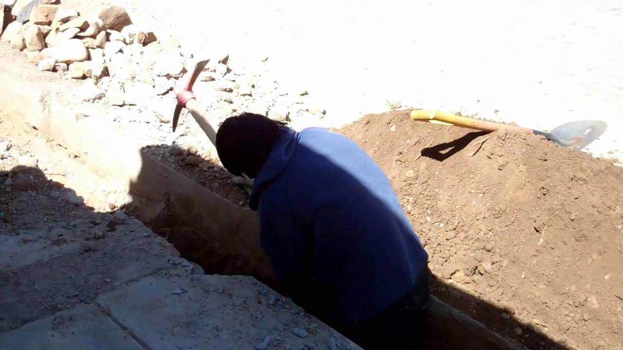 Man digs trench for new gas line - YouTube