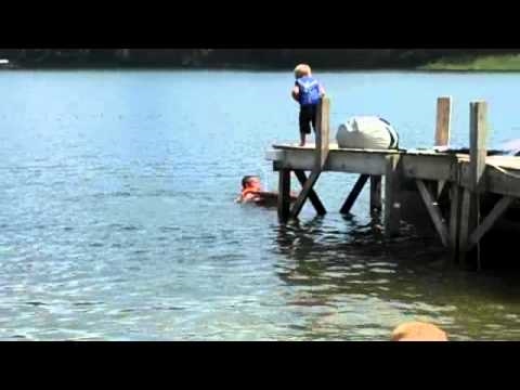 Kids jumping off dock with boogie boards - YouTube