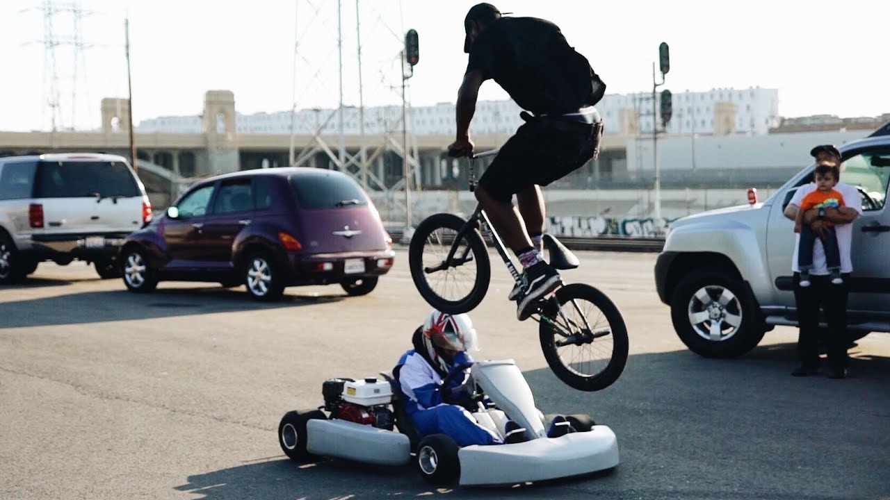 BMX JUMPS OVER MOVING GO KART - YouTube