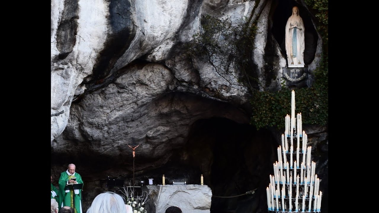 prayer time in holy grotto Lourdes - YouTube