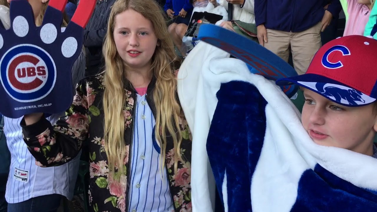 Singing "Go Cubs Go" after the Cubs defeat the Braves on September 1 ...