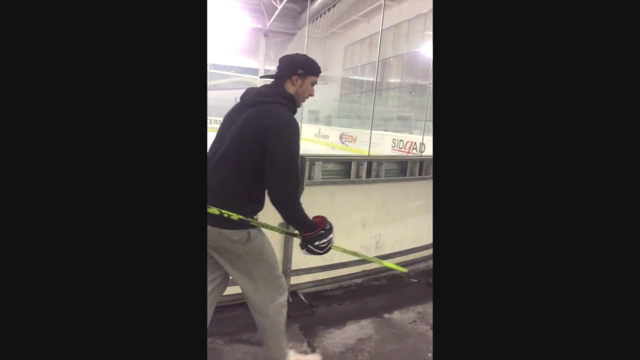 Ruslan Cernych one-hand puck juggling around the rink - YouTube
