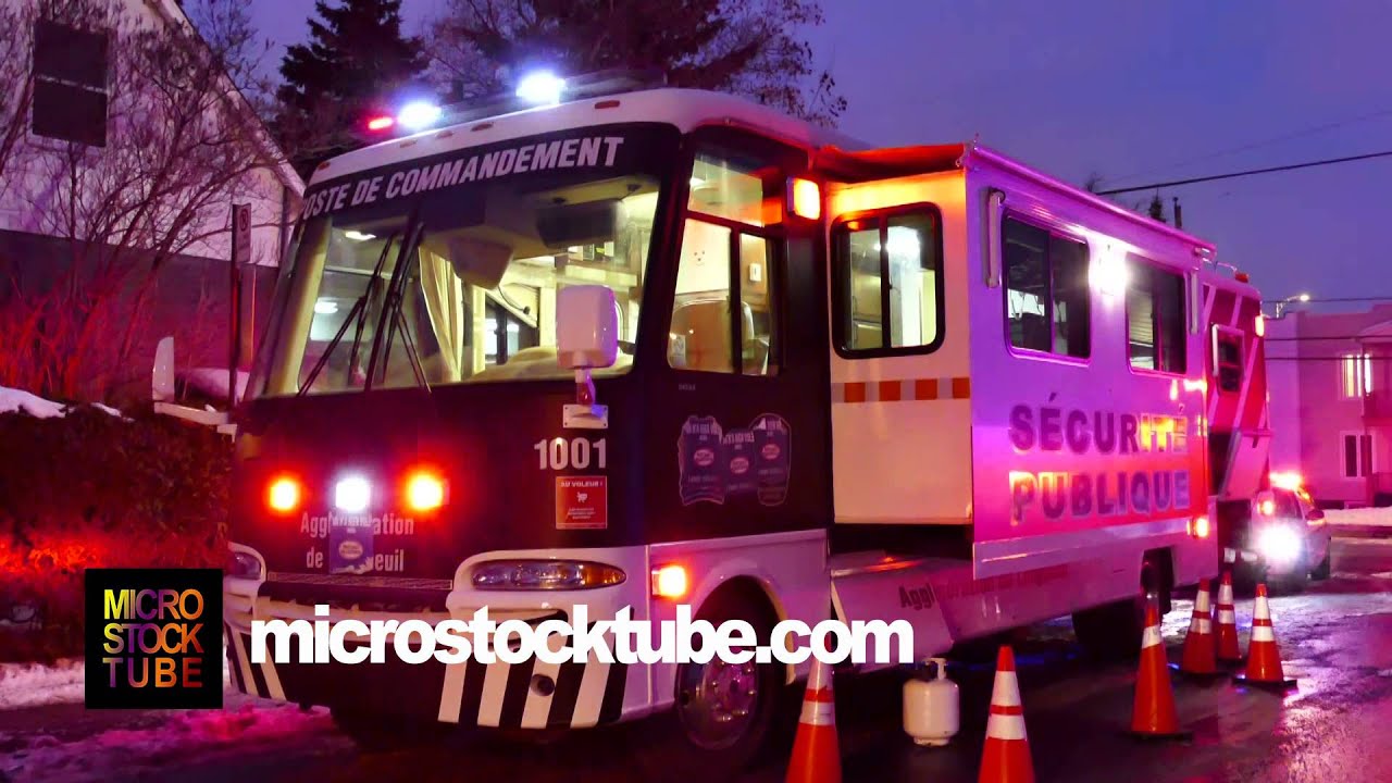 Large police command post vehicle with lights flashing at night ...