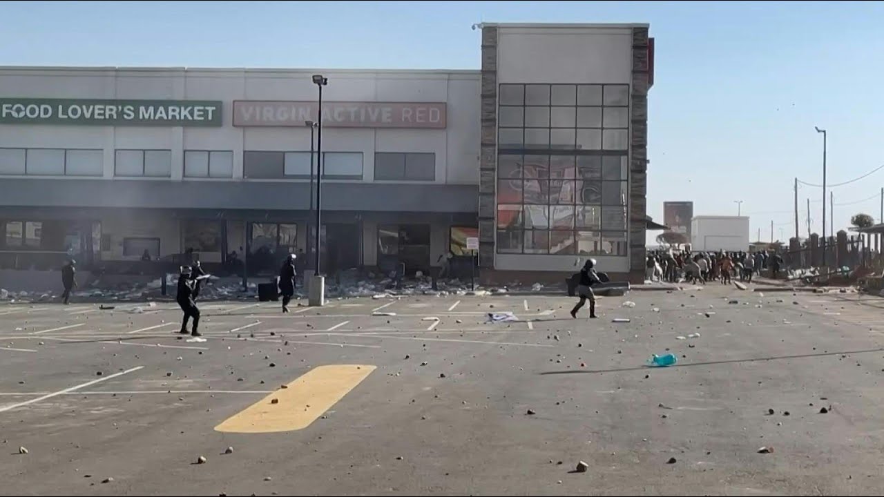 South African police fire rubber bullets to disperse looters | AFP ...