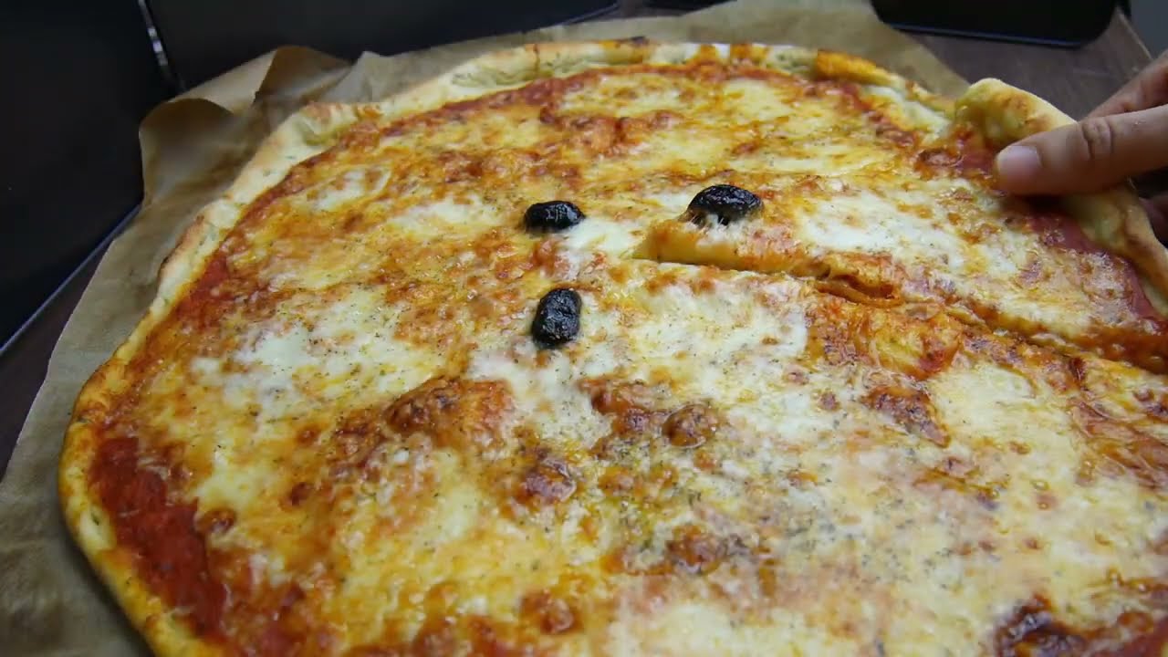 How to Make Maxi Pizzas One with Generous Toppings of Cheese and the ...