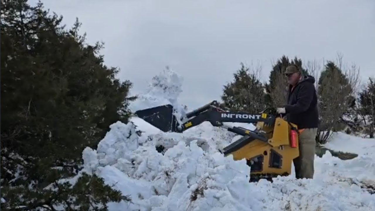 Mini Skid Steer plowing and MOVING heavy WET Snow - YouTube