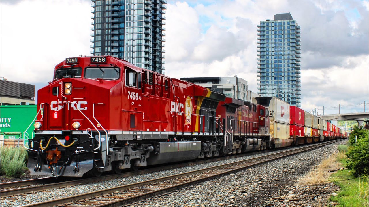 VERY RARE! CPKC 7456 ET44AC new paint unit leading CP stack train Eastbound arriving Calgary ...