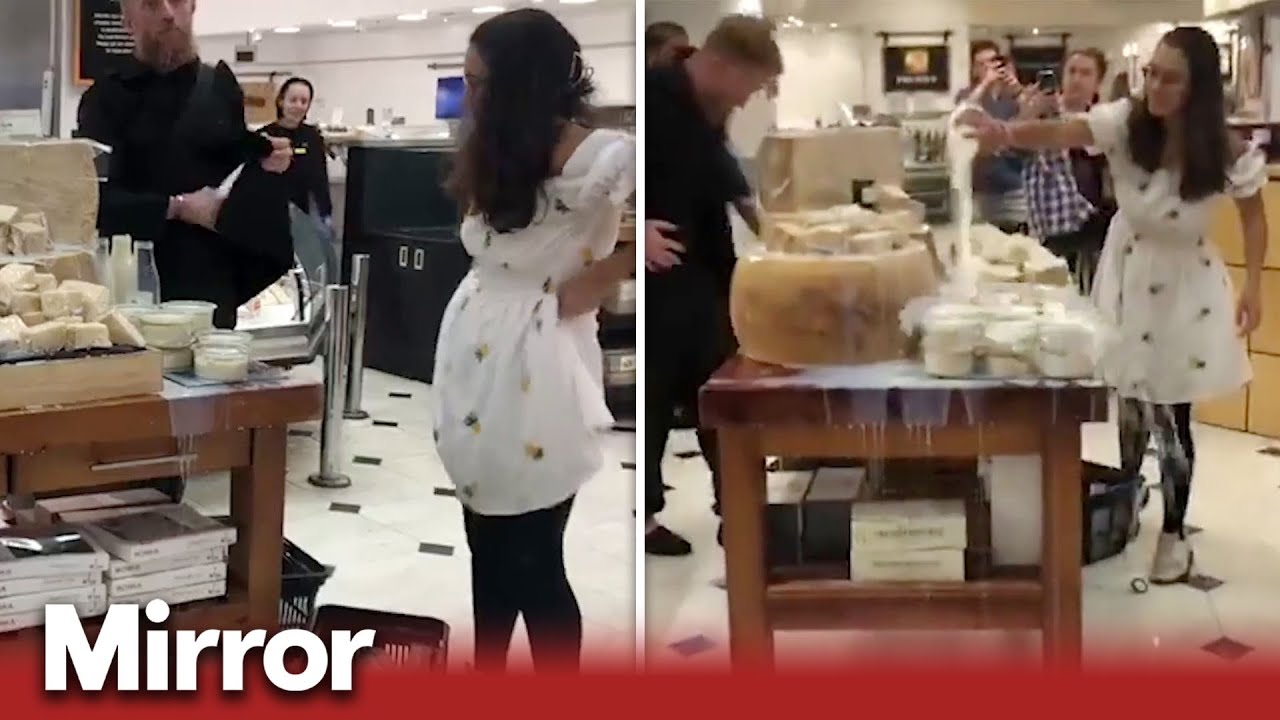 Vegan activists pour milk over Selfridges cheese counter - YouTube