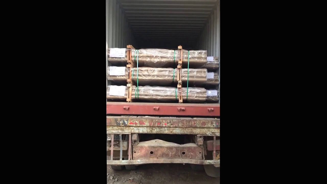 Loading of threaded rods in container - YouTube
