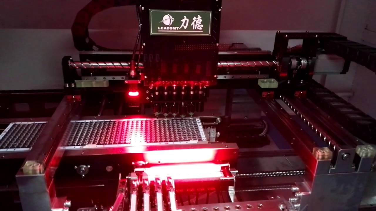 Chinese smt pick and place machine placing ics and resistors and ...