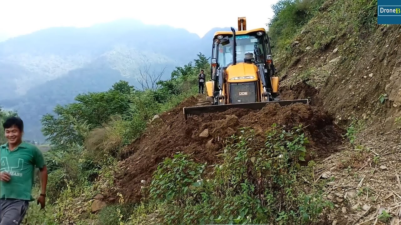 Extremely Narrow Mountain Road Resurfacing with JCB Backhoe - YouTube