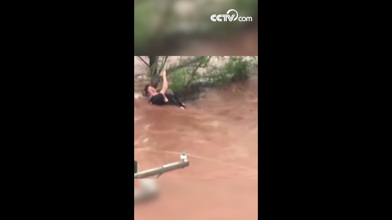 Woman trapped in fast-moving flood| CCTV English - YouTube