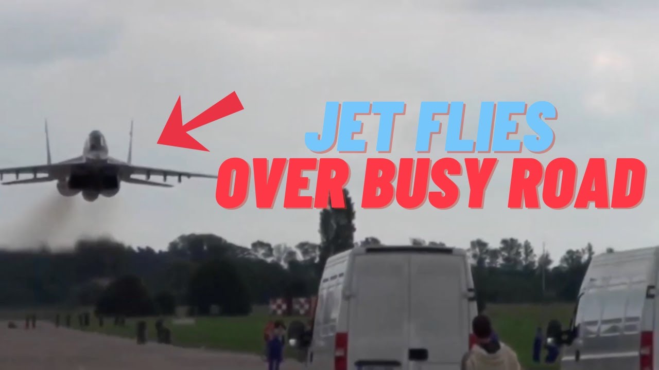 Fighter Jet Flies Over Busy Road - YouTube