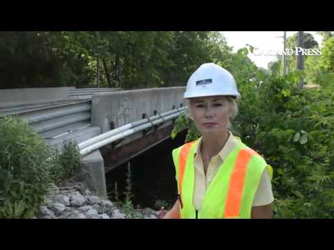 Bridge inspector Amy Trahey checks out a bridge on Orion Road, over ...