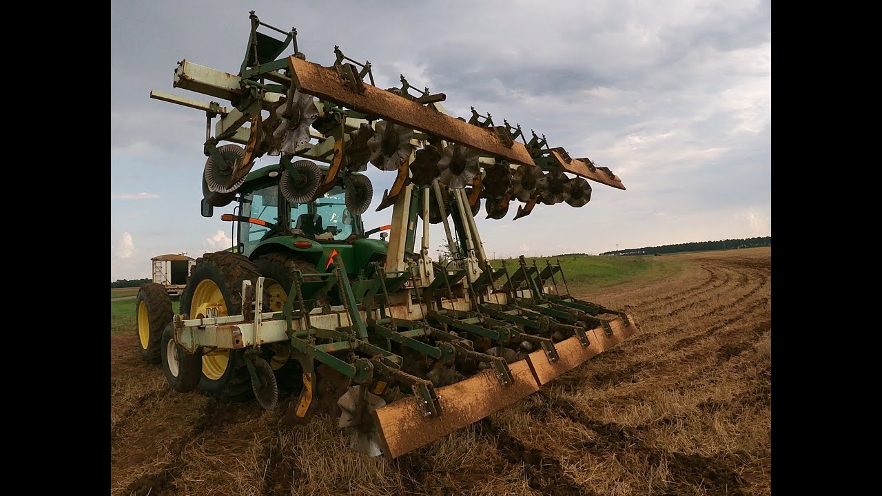 Strip tilling cotton into wheat field - YouTube