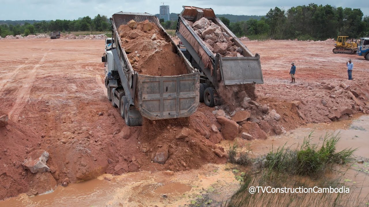 Huge Land Fill Process Hyundia Trago Dump Trucks Unloading Rock ...