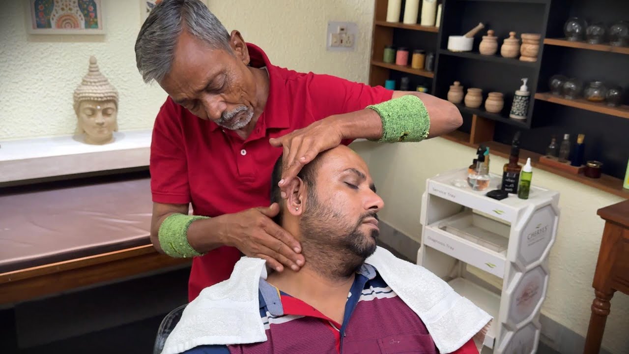 REIKI master enjoying indian champi head massage from old school barber ...