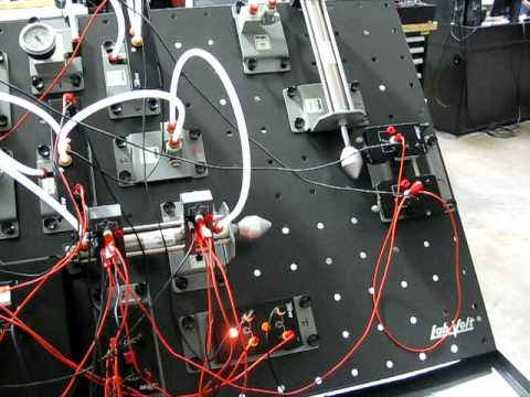 PLC Control of a Pneumatic System - Stamping Simulation - YouTube