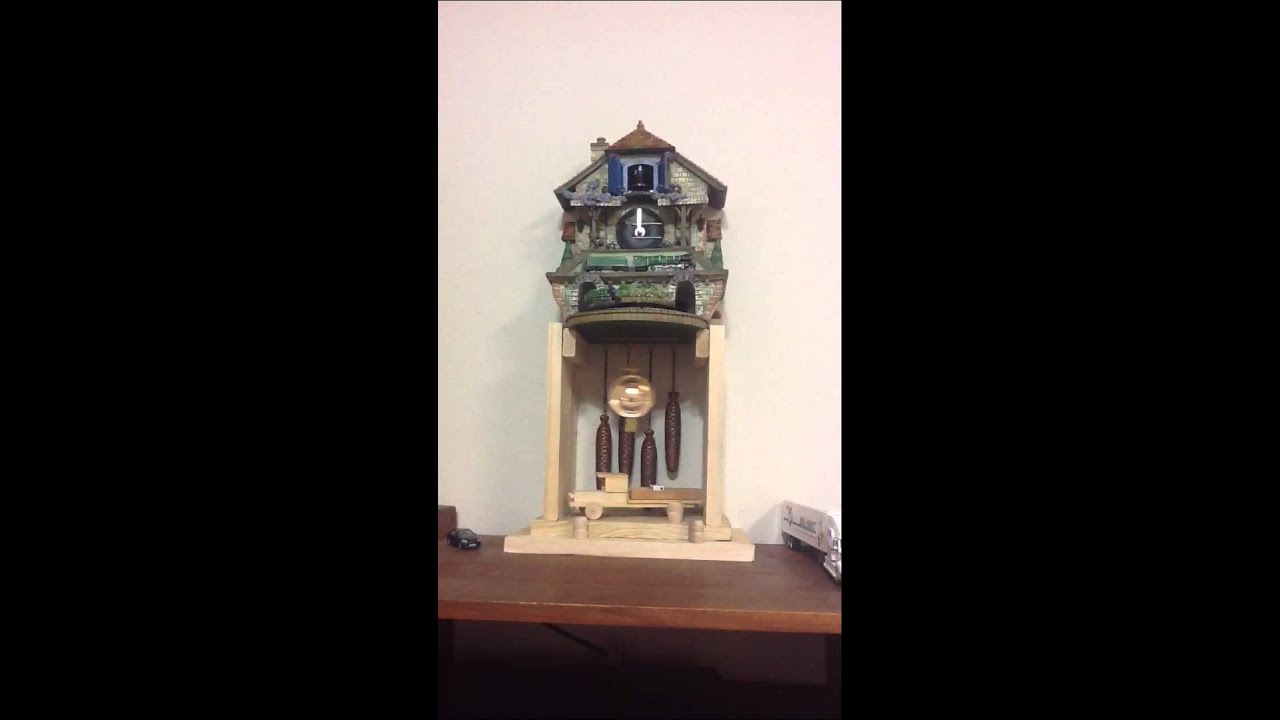 Cuckoo clock with a train - YouTube
