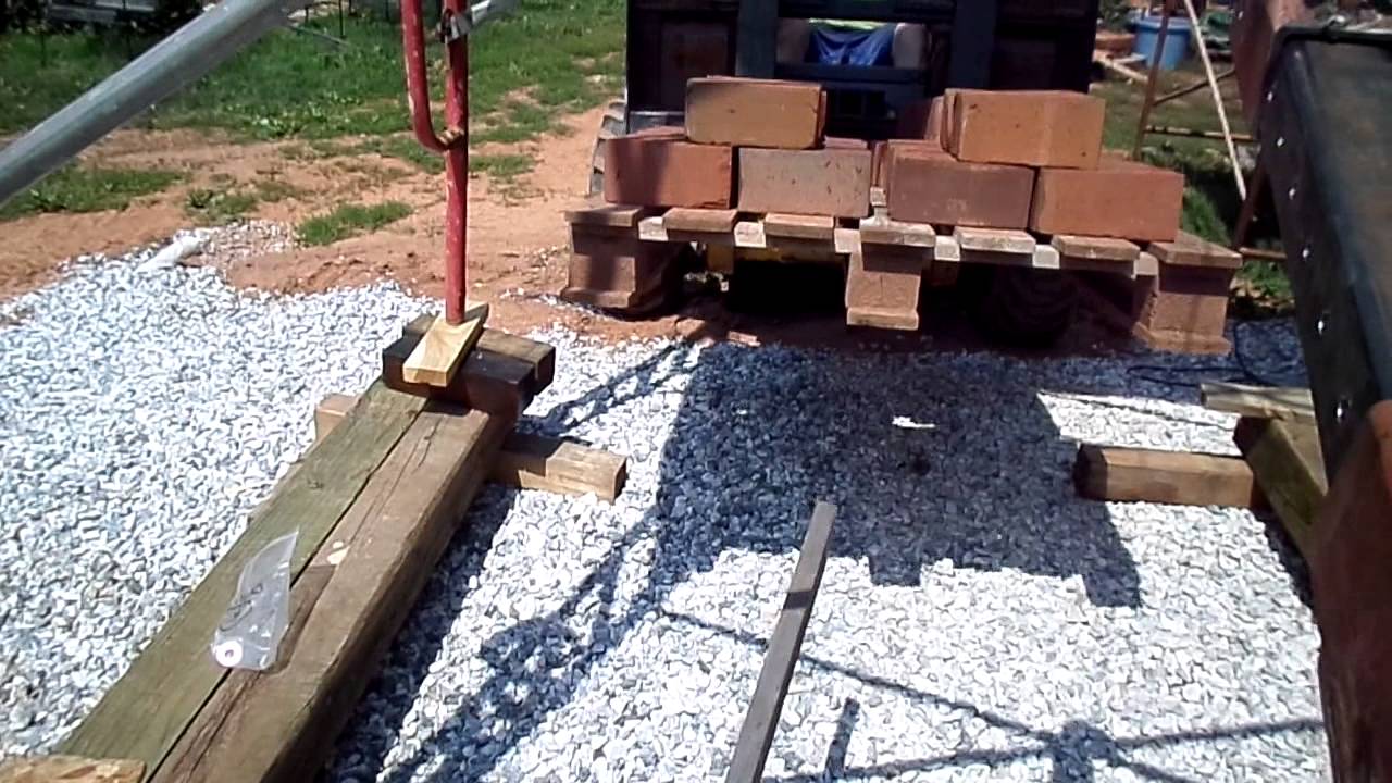 Skid Steer Moving Small Pallets of Brick - YouTube