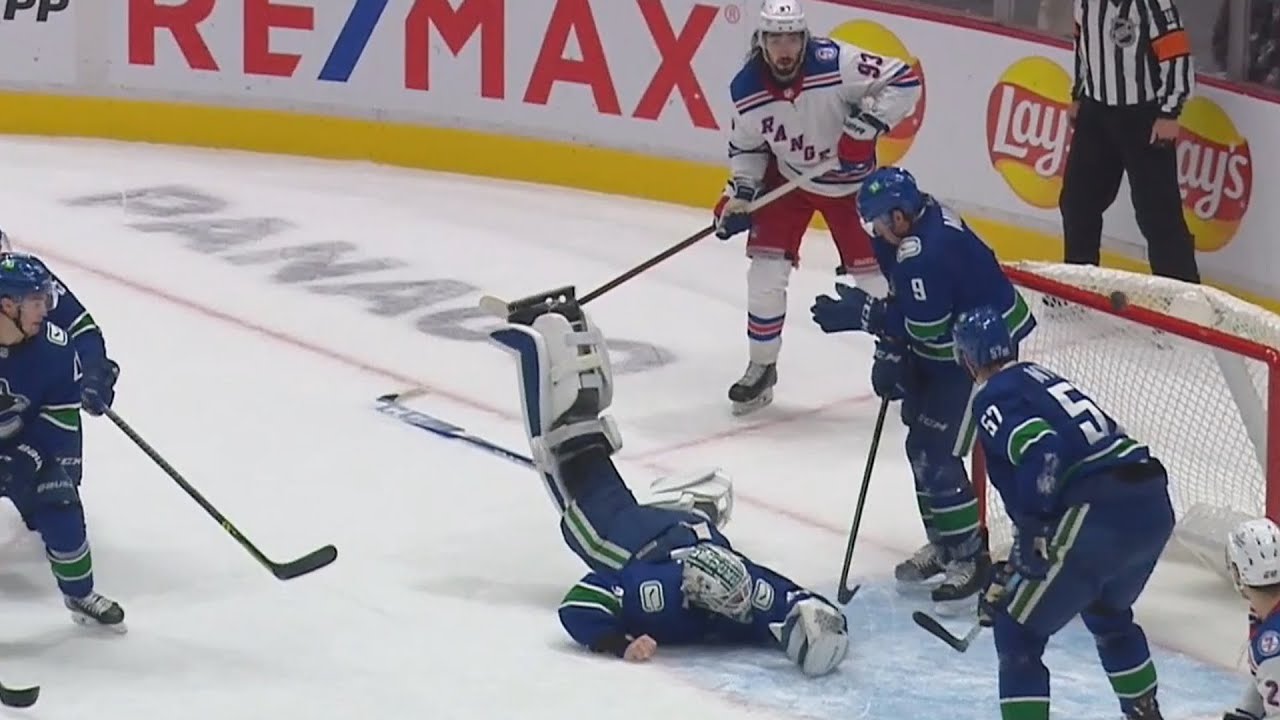 Thatcher Demko Loses Glove Makes Saves As Play Continues - YouTube