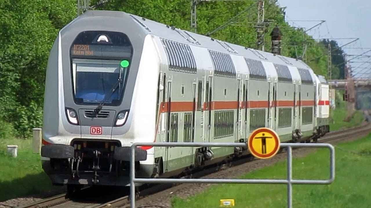 Germany: At Kirchweyhe (near Bremen), a DB IC2 Class 147 passes on a ...
