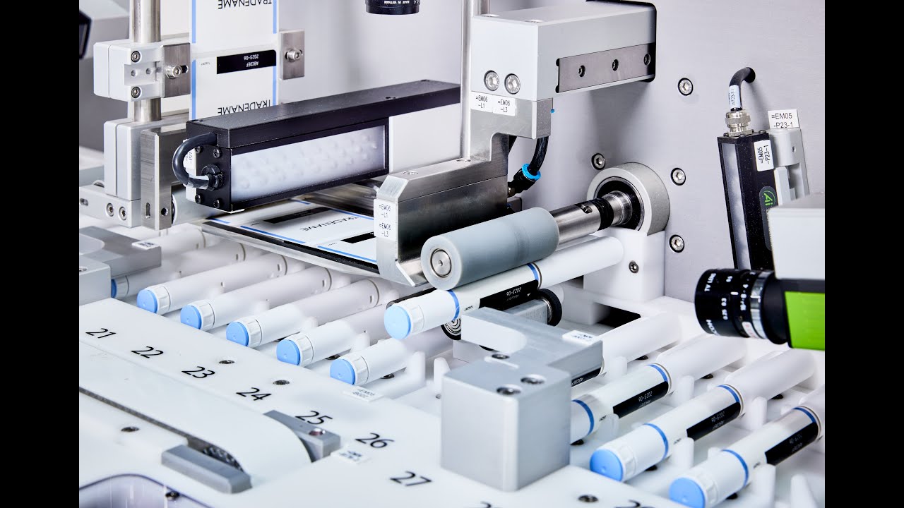 Labelling of pen injectors in trays - YouTube