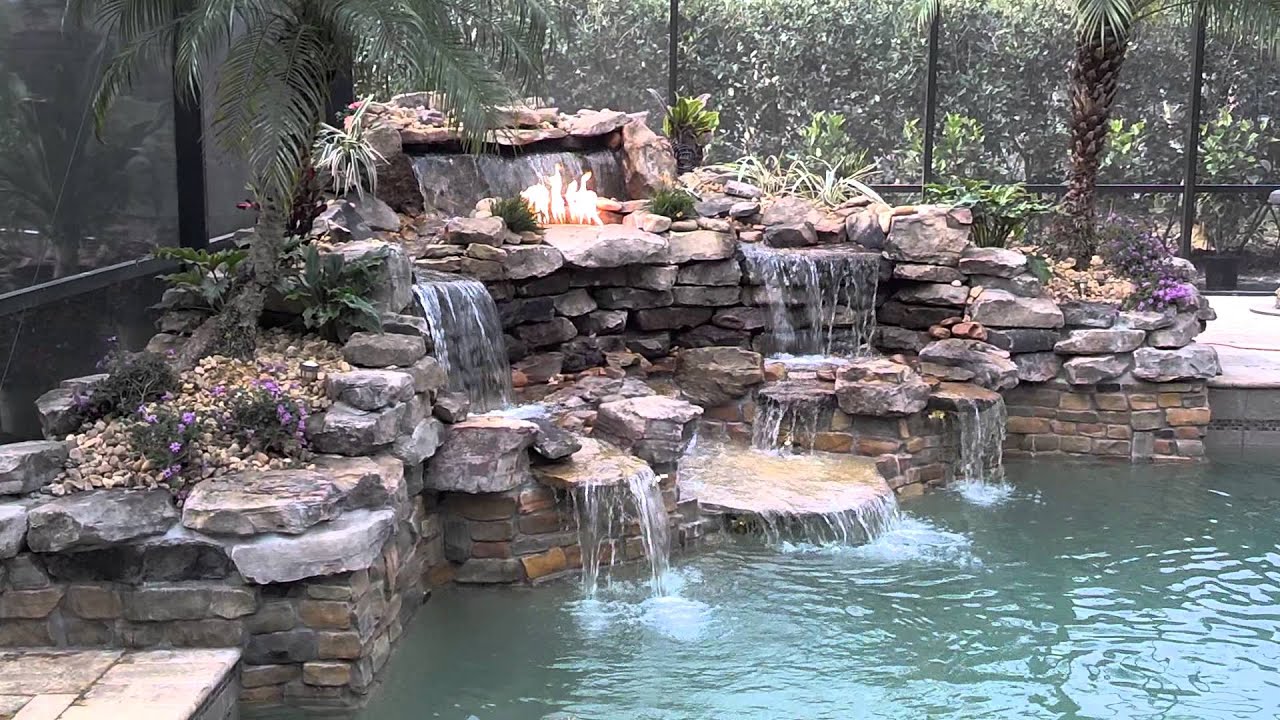 Swimming pool waterfall with fire effect - YouTube