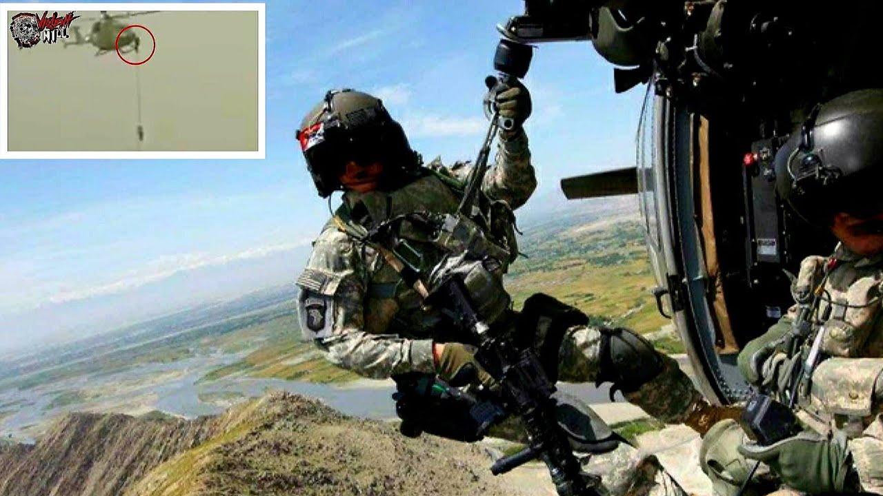 Soldier falls out of helicopter during slithering exercise - YouTube